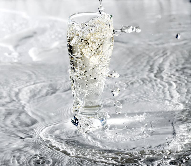 Running water into a glass stock image. Image of cold - 12623981