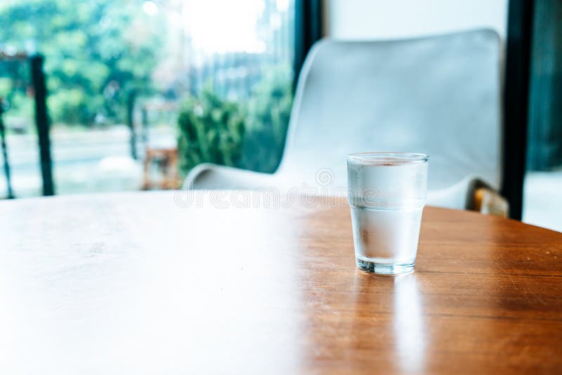 Glass of water on table stock photo. Image of freshness - 207069044