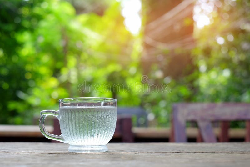Glass Water on Wooden Table with Blurred Background. Stock Photo ...