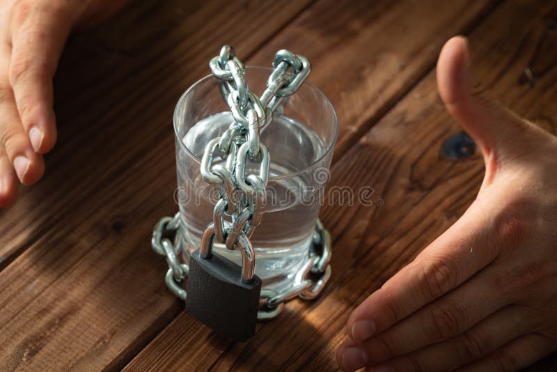 A Glass of Water Wrapped in a Chain and Closed with a Padlock. the ...