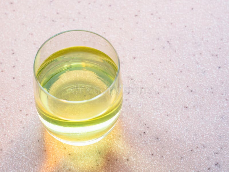 Glass of Water with Yellow Solution of Vitamin Stock Photo - Image of ...
