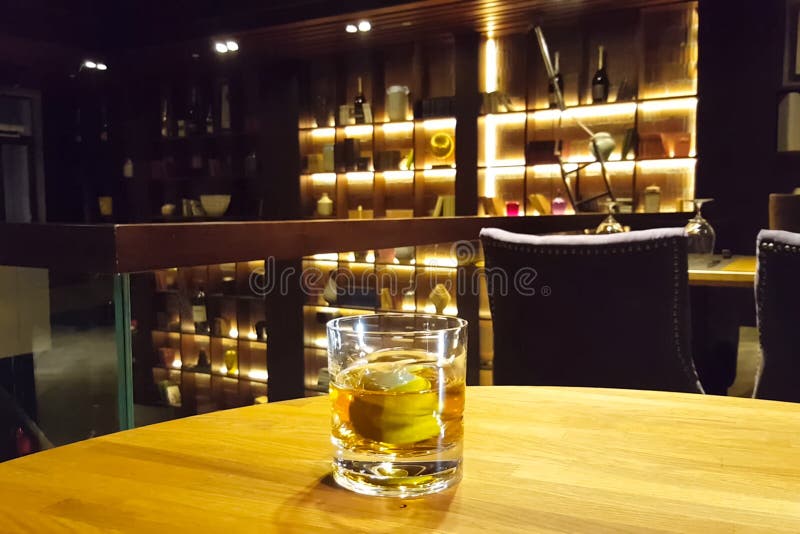 Glass of Whiskey on a Table in a Bar. Alcoholic Drink Stock Photo ...