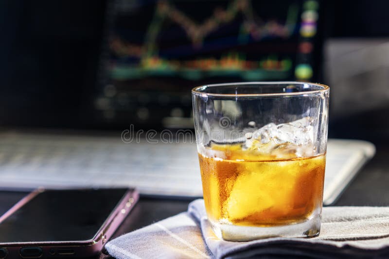 Glass of Whiskey on Table with Tablet Shows Stock Market Stock Image ...