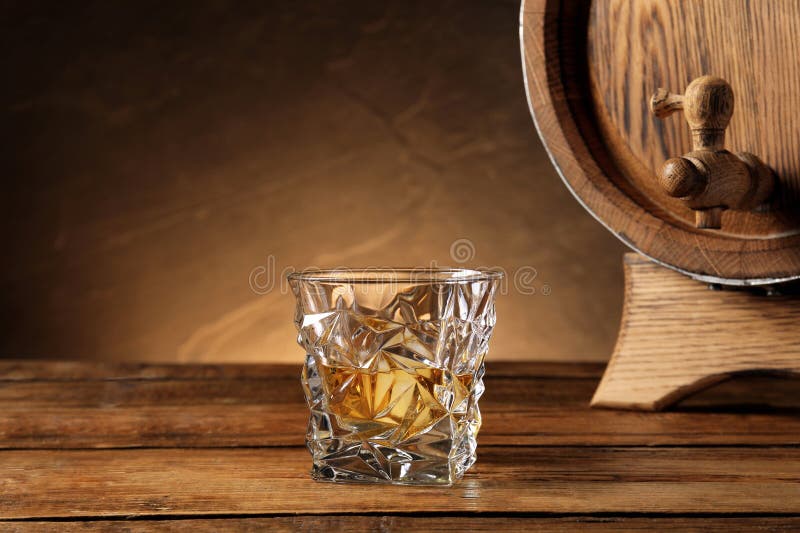 Glass of Whiskey and Wooden Barrel on Table, Space for Text Stock Image ...