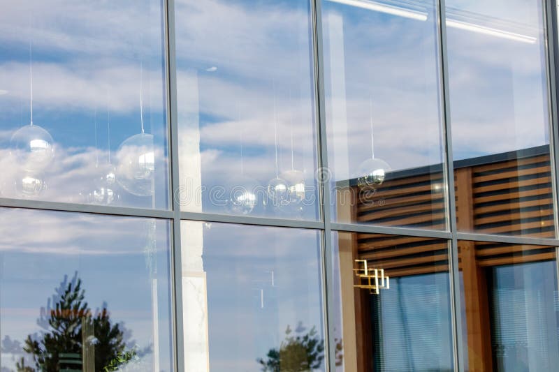 The Glass Window is Reflecting the Sky and the Clouds Stock Photo ...