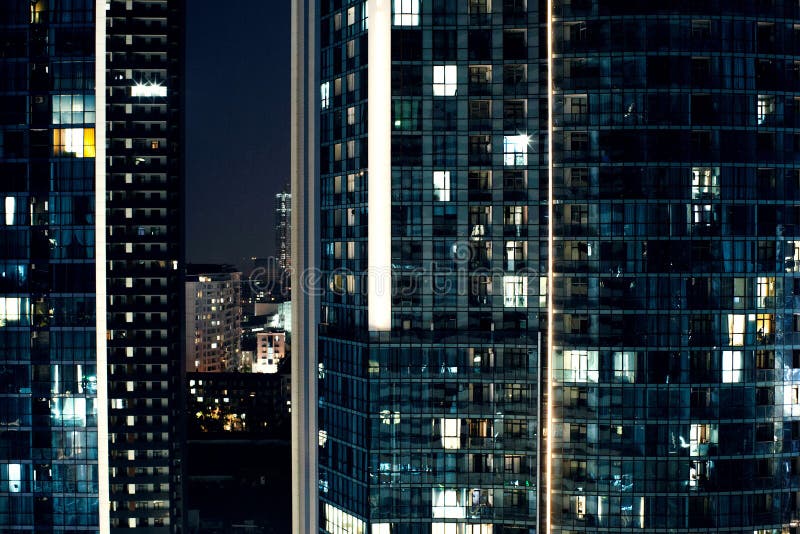 Glass Windows and Skyscraper Balconies at Night with Glowing Windows. Stock Photo - Image of ...