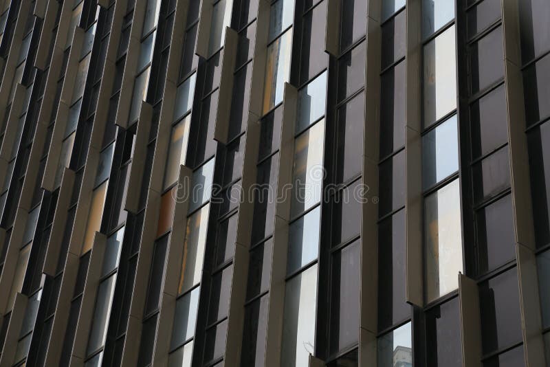 Glass Windows in Tall Building Stock Image - Image of tall, exterior ...
