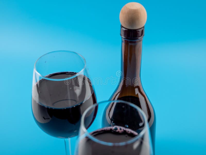 A Glass of Wine on a Blue Background. Stock Photo - Image of event ...