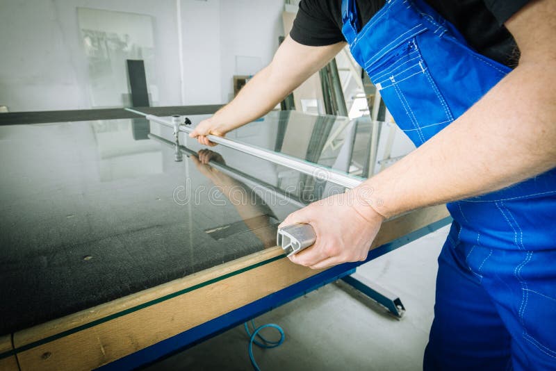 The Glazier Worker Cuts the Glass with a Special Tool. Glassworks Stock ...
