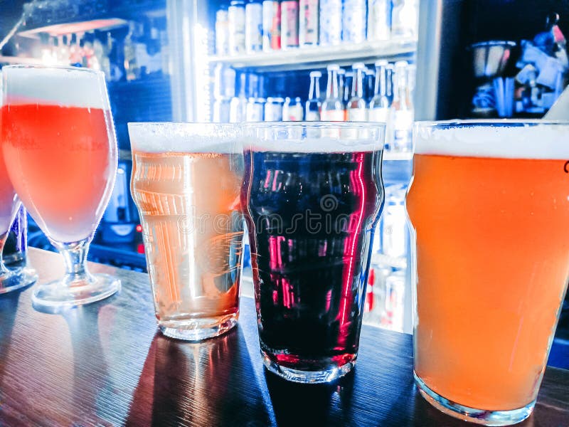 Glasses with Beer and Cocktails on Bar Counter Stock Image - Image of ...
