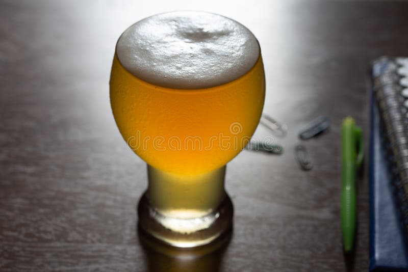 Glasses of Beer and Office Accessories on Wooden Table Stock Image ...