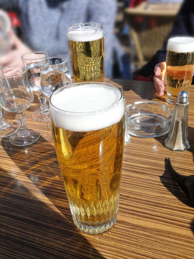Beer and Water Glasses stock image. Image of water, gold - 23037143