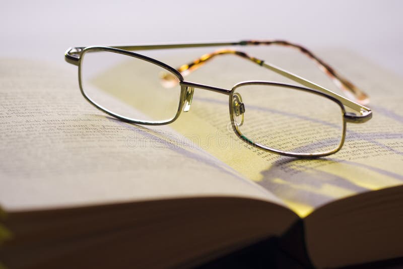 Glasses on a book stock image. Image of eyes, white, read - 18223309