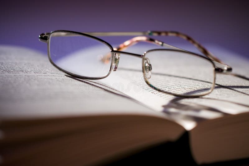 Glasses on a book stock image. Image of sight, literature - 18223347