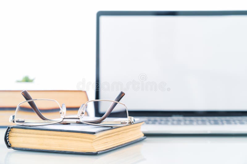 Glasses on Book with Blank Screen Laptop Computer on Deck Stock Photo ...