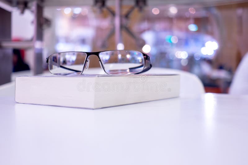 Glasses and Book in Library Stock Photo - Image of education, culture ...
