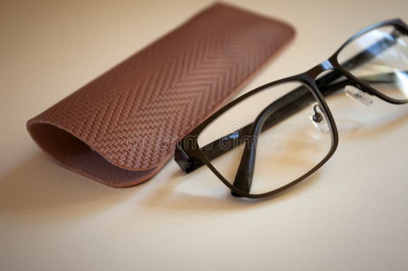 The Glasses and Case Lie on the Counter Stock Photo - Image of ...