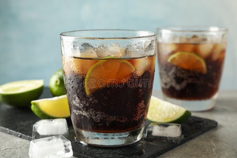 Glasses with Cold Cola and Citrus on Grey Table Stock Image - Image of ...