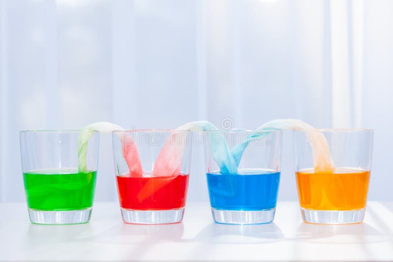 Glasses with Colored Liquid. Chemical Experiments for Children Stock ...