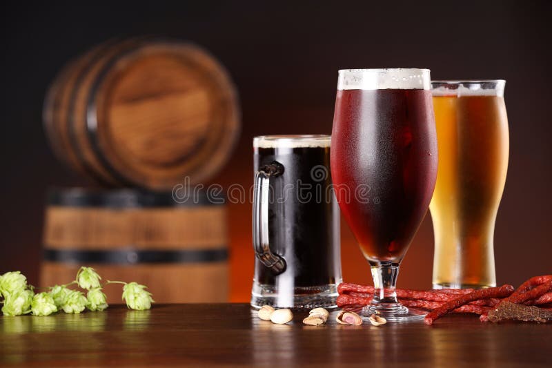 Glasses with Different Types of Beer, Snacks and Fresh Hops on Wooden ...