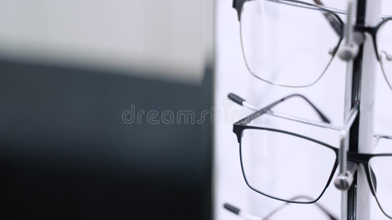Showcase with Spectacles in Modern Ophthalmic Store. Glasses on Display ...