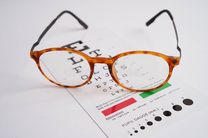 Glasses on Eye Exam Chart To Test Eyesight Accuracy of Reading Stock ...