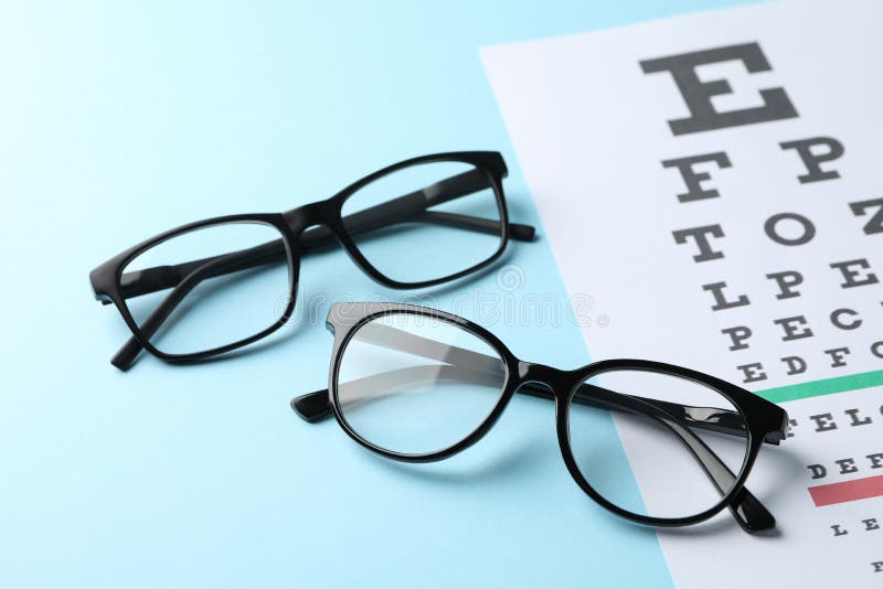 Glasses and Eye Test Chart on Blue Background Stock Image - Image of ...