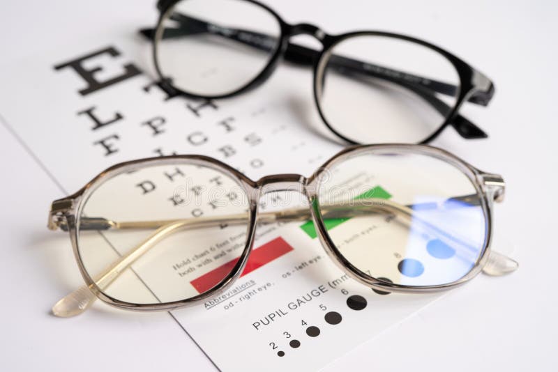Glasses on Eye Testing Exam Chart To Check Eyesight Accuracy of Reading ...