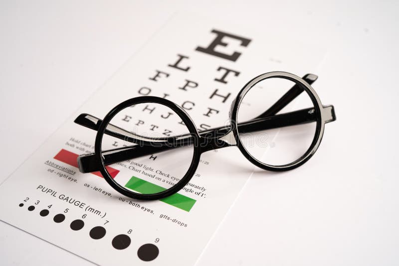Glasses on Eye Testing Exam Chart To Check Eyesight Accuracy of Reading ...