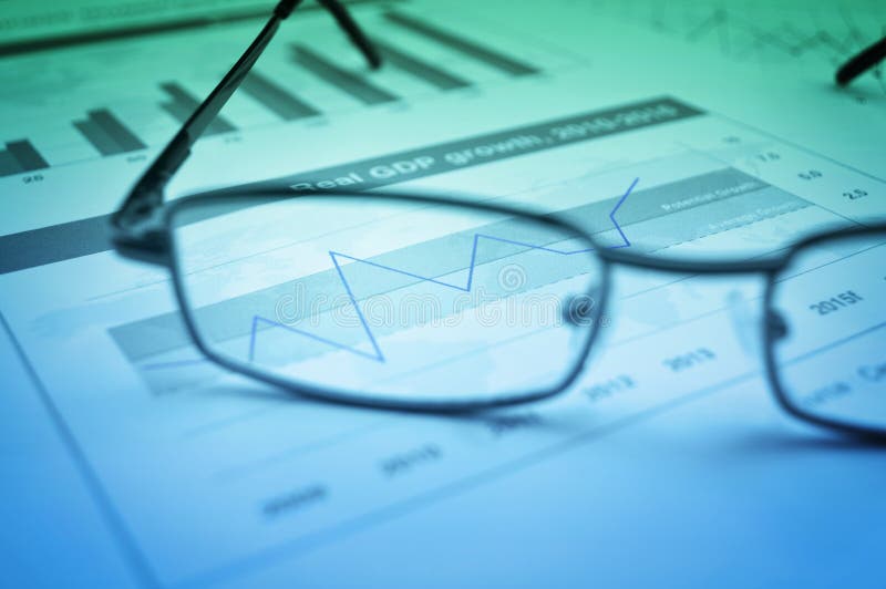 Glasses on Financial Chart and Graph, Accounting Background Stock Photo ...