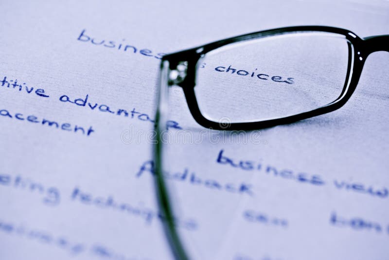 Glasses with Focus on Business Choices Stock Image - Image of ...