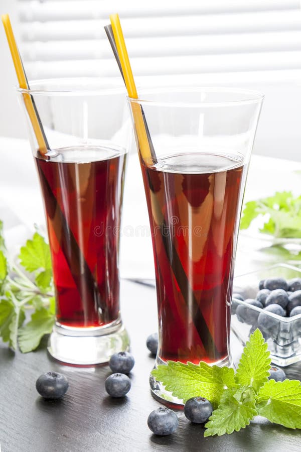 Glasses with Fresh Black Currant Juice. Bog Blueberry and Lemon Balm ...