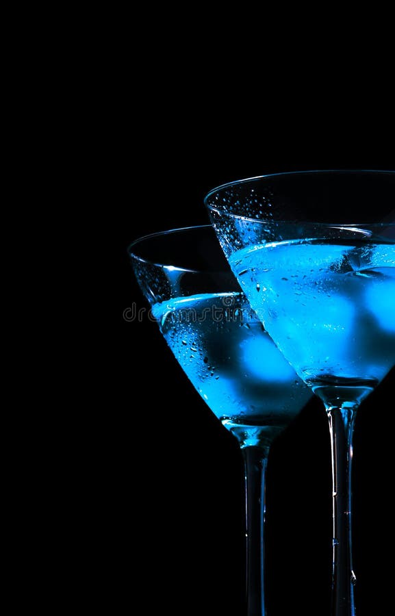 Glasses of Fresh Blue Cocktail with Ice on Black Background Stock Image ...