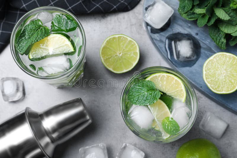 Glasses of Fresh Mojito Cocktail on Table, Flat Lay Stock Photo - Image ...