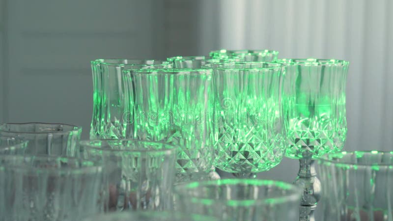 Glasses green backlight stock video. Video of crystal - 237150209