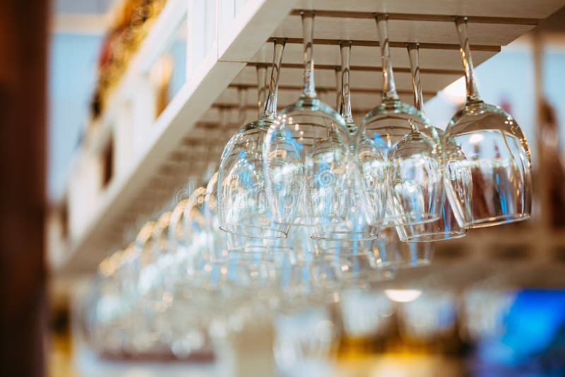 Glasses Hanging Over Bar Rack. Empty Glasses for Wine Above a Bar Stock ...