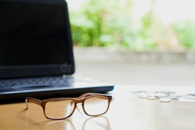 Glasses on a laptop stock photo. Image of business, closeup - 149361042