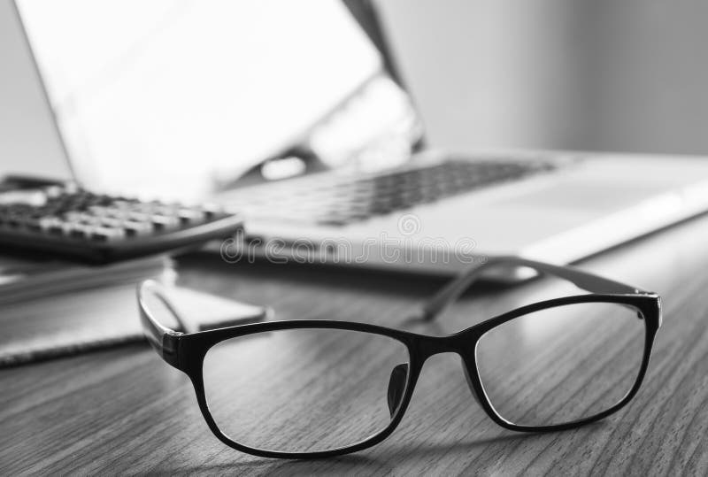 Glasses and Laptop on the Desk Work Place in Black and White Stock ...
