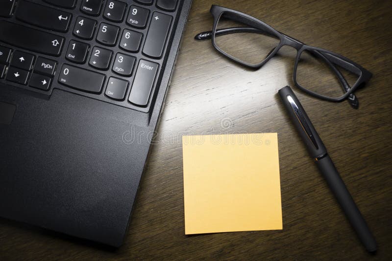 The Glasses with the Laptop , Paper Note and the Pen on the Brown ...