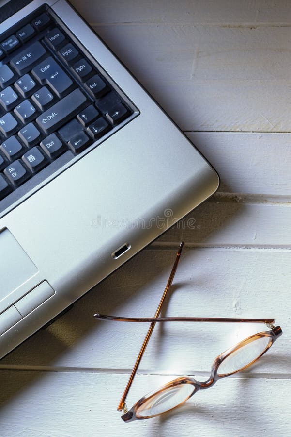 Glasses and laptop stock photo. Image of home, wooden - 77952680