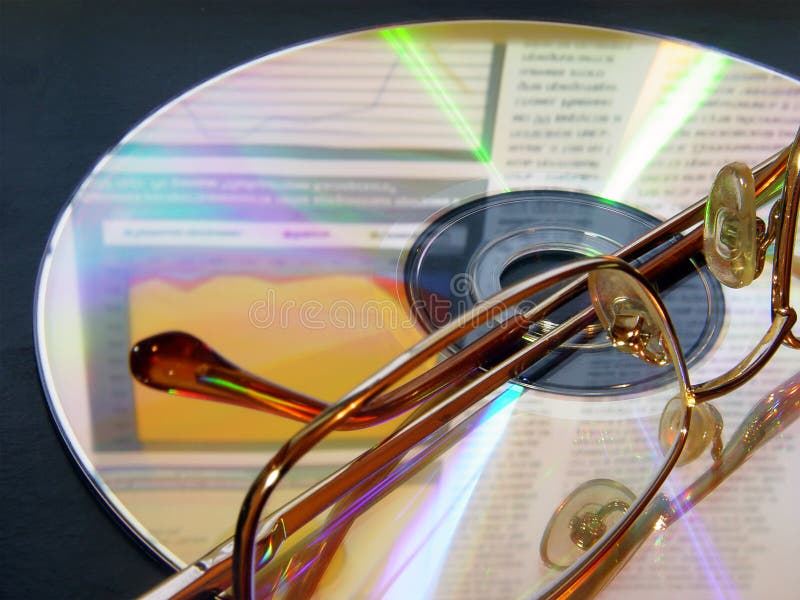 Glasses laying on the CD stock image. Image of forward - 3253057