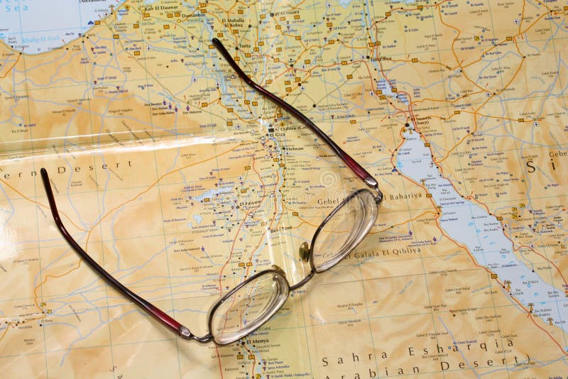 Glasses laying on a map stock photo. Image of buying, currency - 4242254