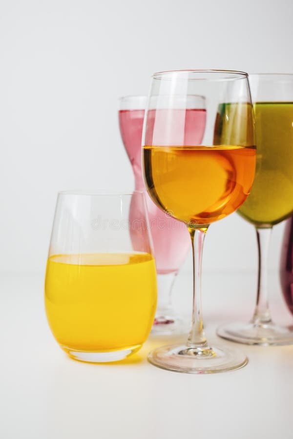 Glasses with Multi-colored Drinks on a White Background Stock Photo ...