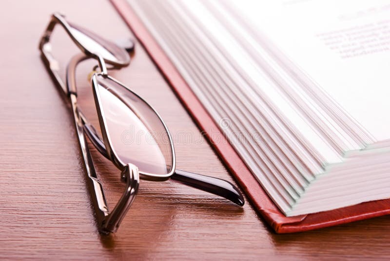 Glasses and open book stock photo. Image of novel, open - 15932034