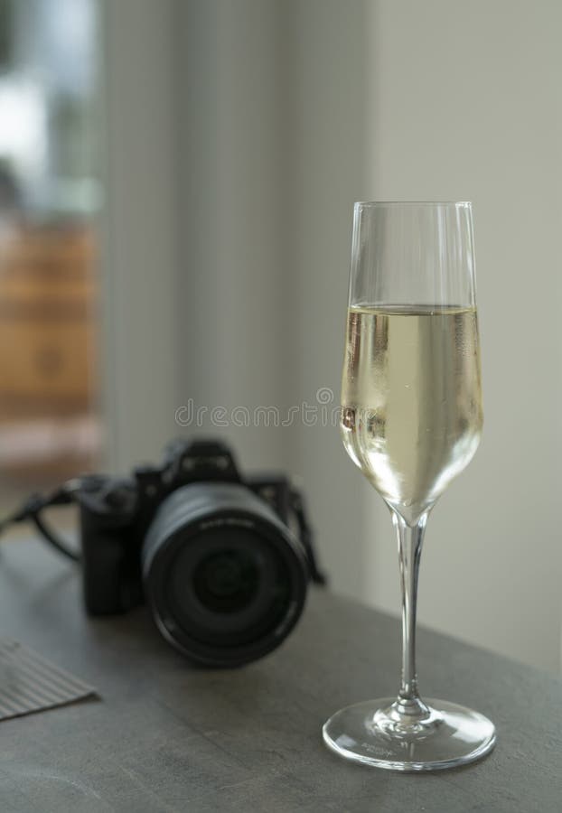Glasses of Prosecco Wine and Camera on the Table Stock Image - Image of ...