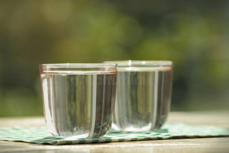Glasses of Pure Water on Wooden Table, Closeup Stock Image - Image of ...