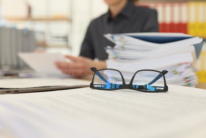 Glasses Put on Papers Near Stack of Folders with Documents Stock Photo ...