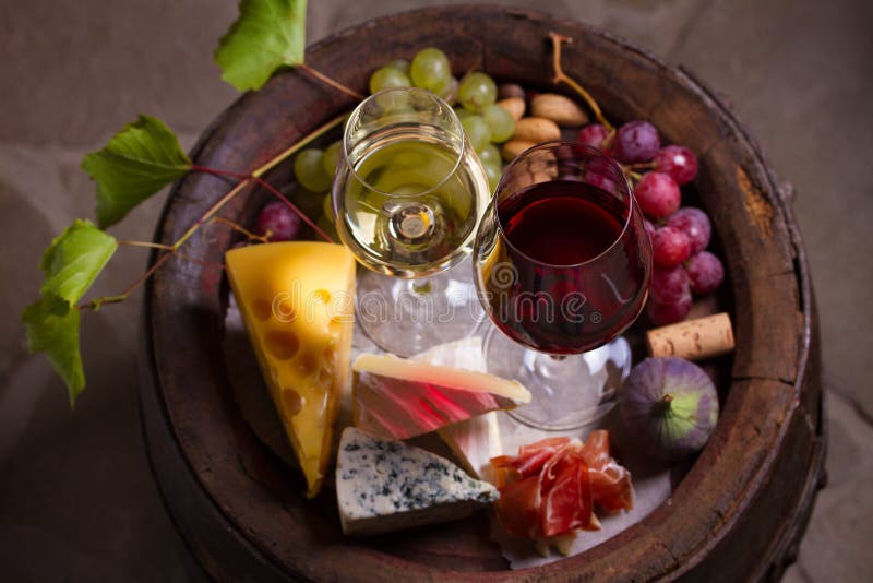 Glasses of Red and White Wine in Wine Cellar Stock Photo - Image of ...