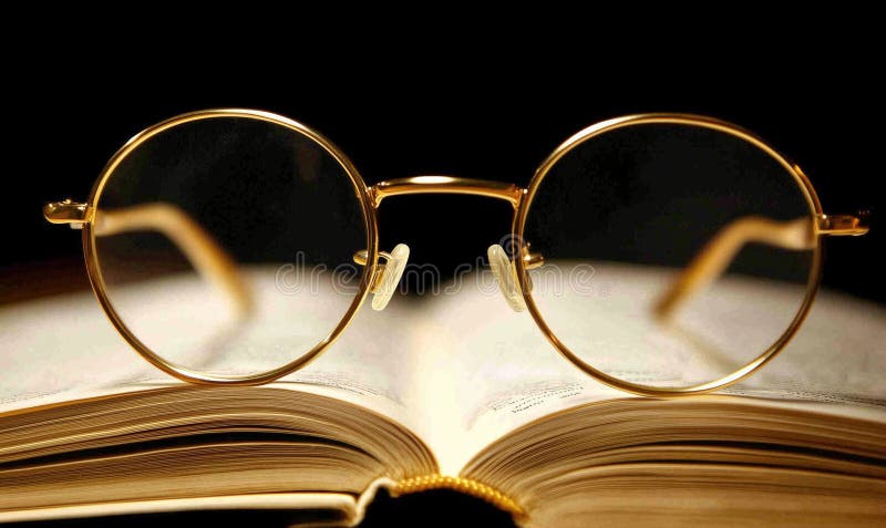 Glasses Resting on Open Book, Symbolizing Knowledge and Reading, with ...
