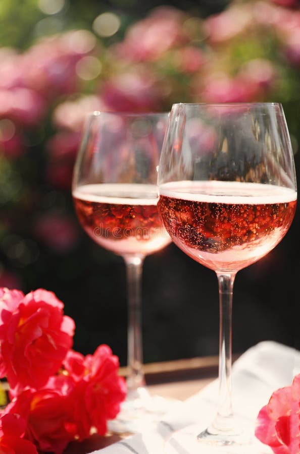 Glasses of Rose Wine on Table in Garden Stock Photo - Image of leisure ...